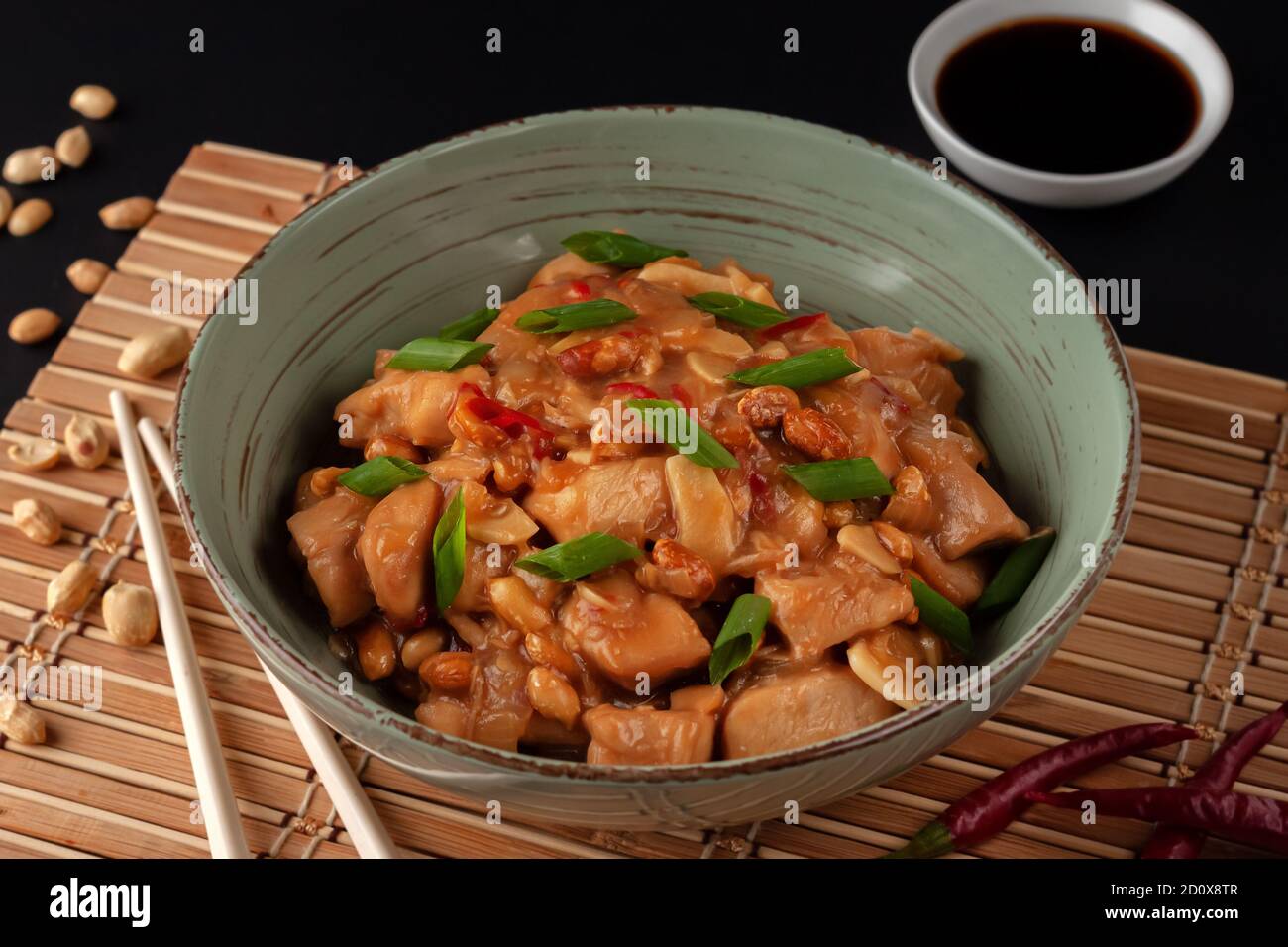 Kung Bao chicken on a black background. A Chinese dish with chicken ...