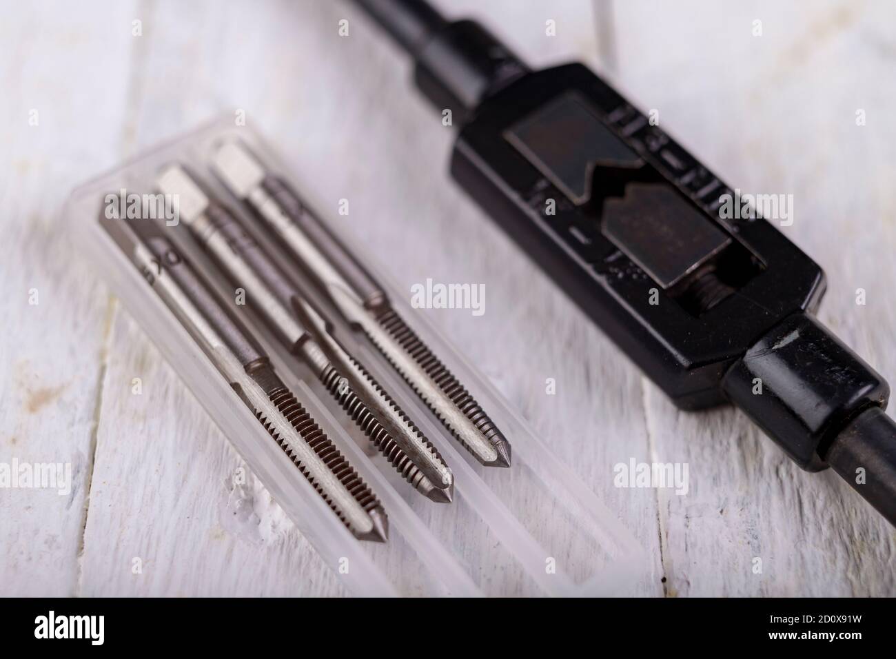Metal taps prepared for work. Accessories in the locksmith's workshop ...
