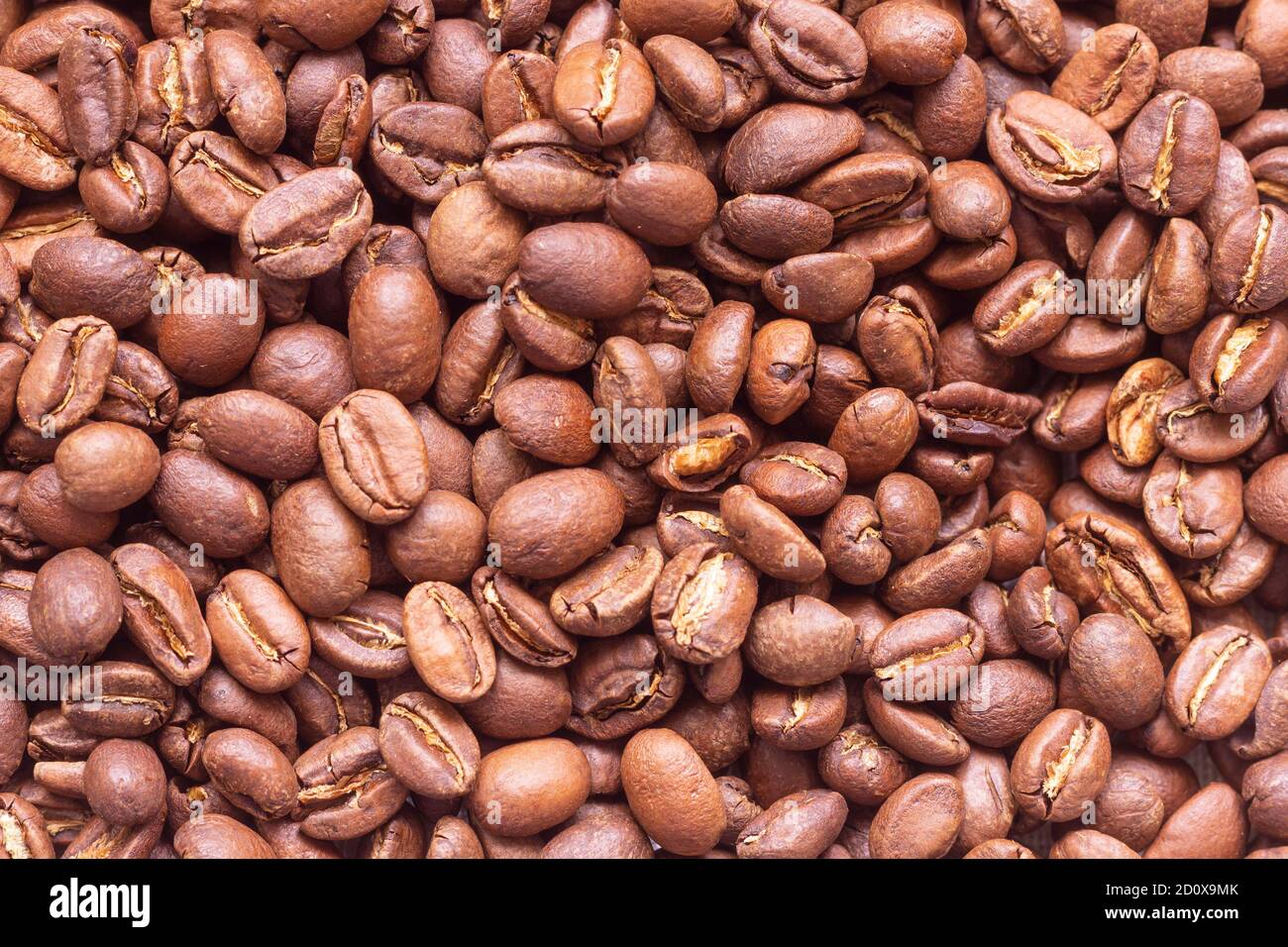 Roasted arabica coffee beans scattered in a heap on the table Stock ...