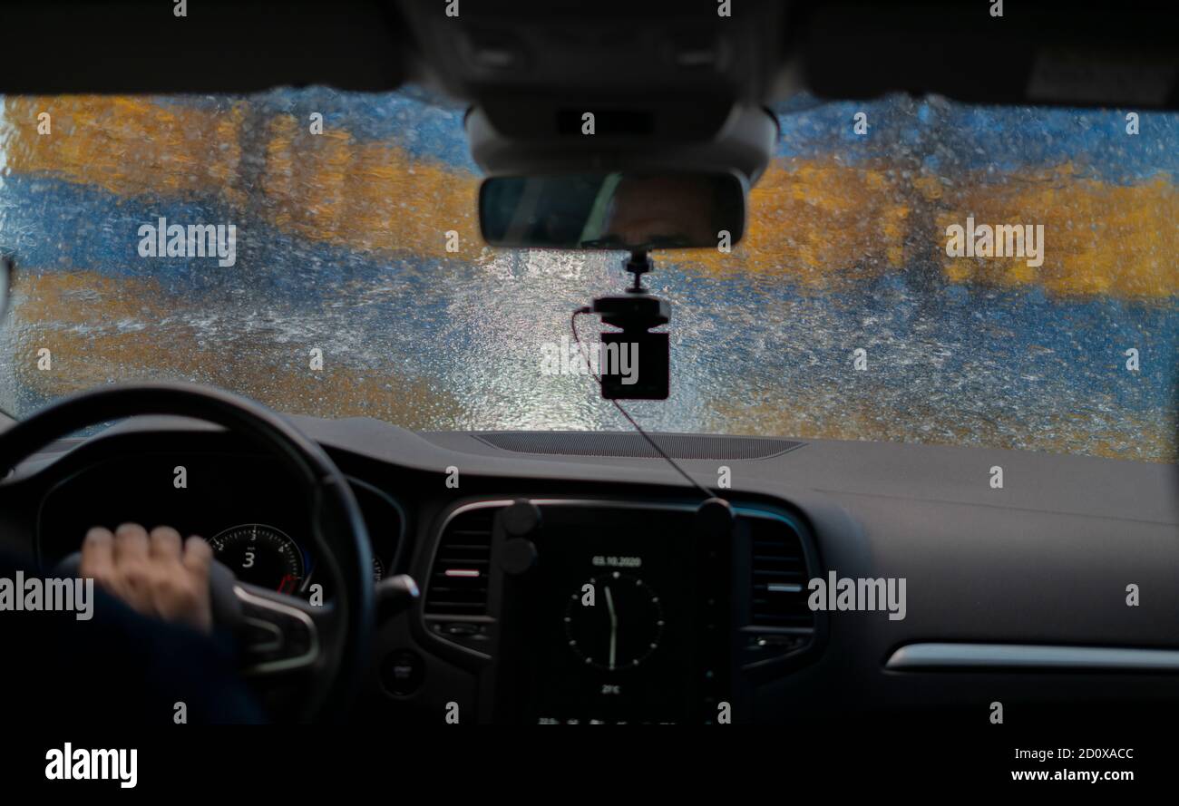 automatic car wash viewed from inside the car. Car sanitization concept ...