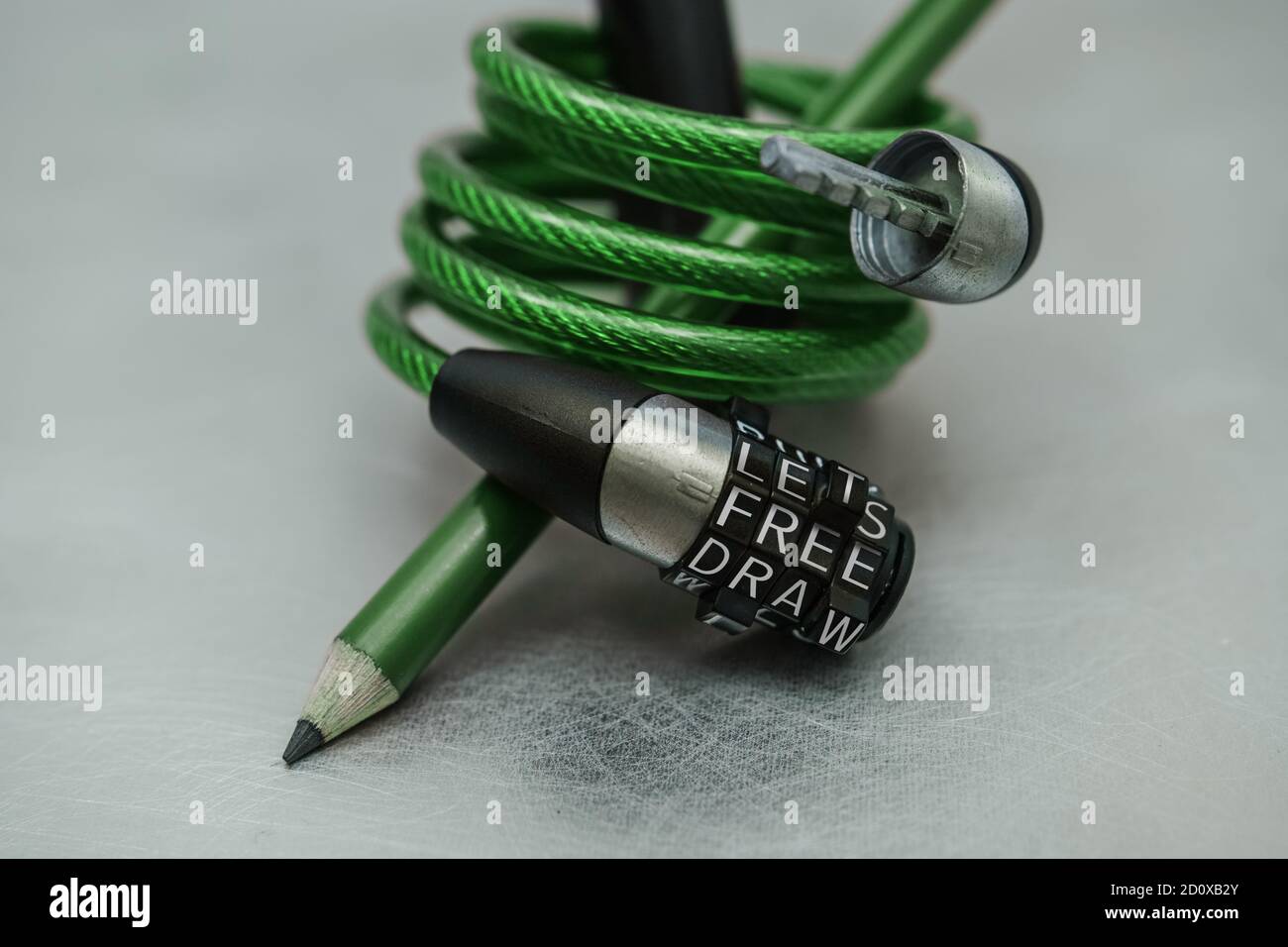 A bike padlock chain with the code: FREE. you can see the words Let's ...