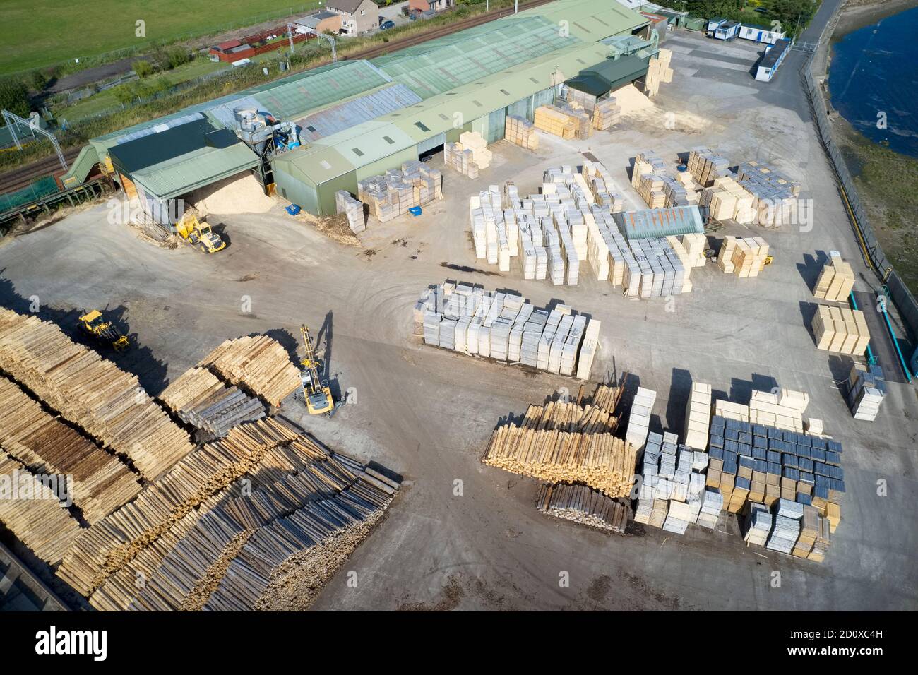 Sawmill aerial view chopped tree wood logs stacks in a row with ...