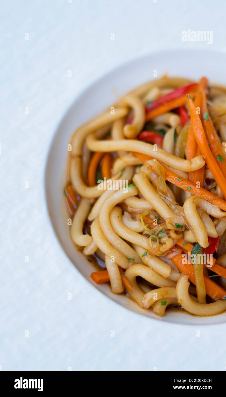the udon whit the vegetables on the plate Stock Photo - Alamy