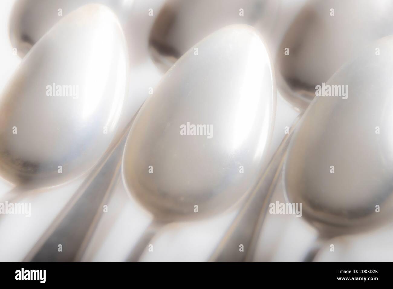 close-up of silver tablespoons, white background Stock Photo - Alamy