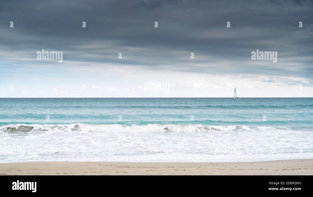 poetto beach with a sailboat. Freedom concept Stock Photo - Alamy