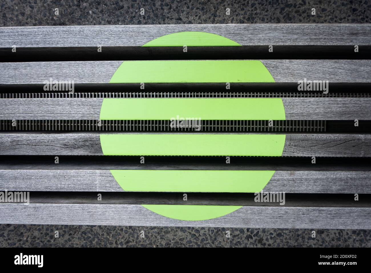 Close-up of a bench with a green circle. Sitting spot with a dot Stock ...