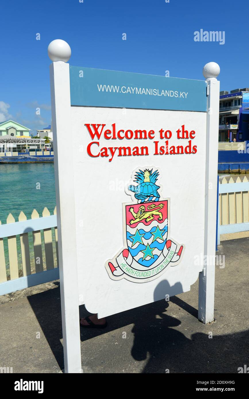 Welcome to the Cayman Islands sign and Coat of Arms at the waterfront ...