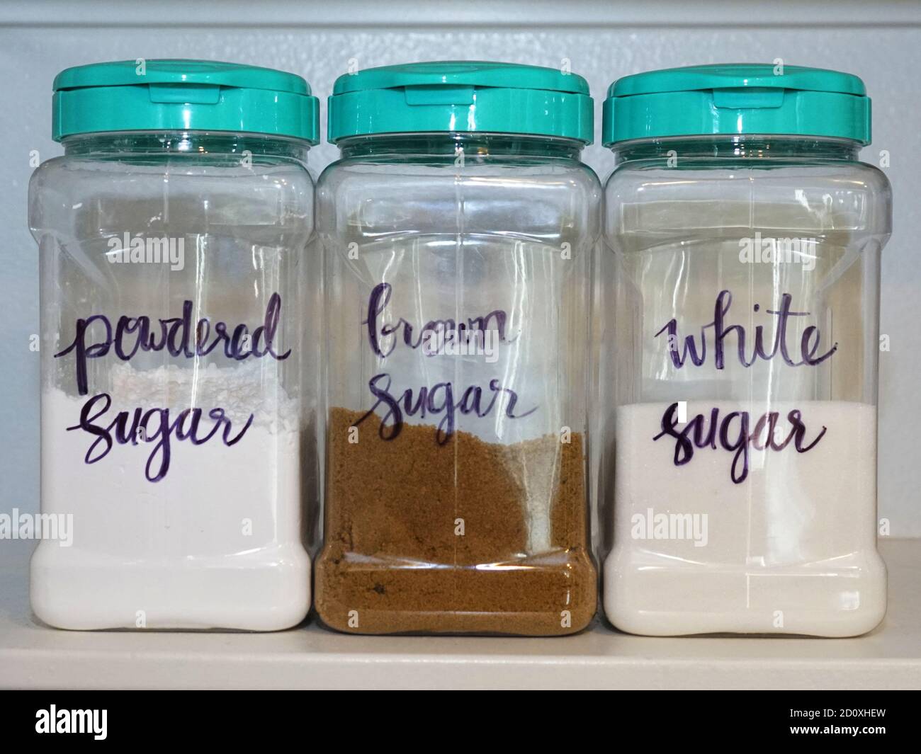 Labelled sugar storage cannisters on pantry shelf Stock Photo - Alamy
