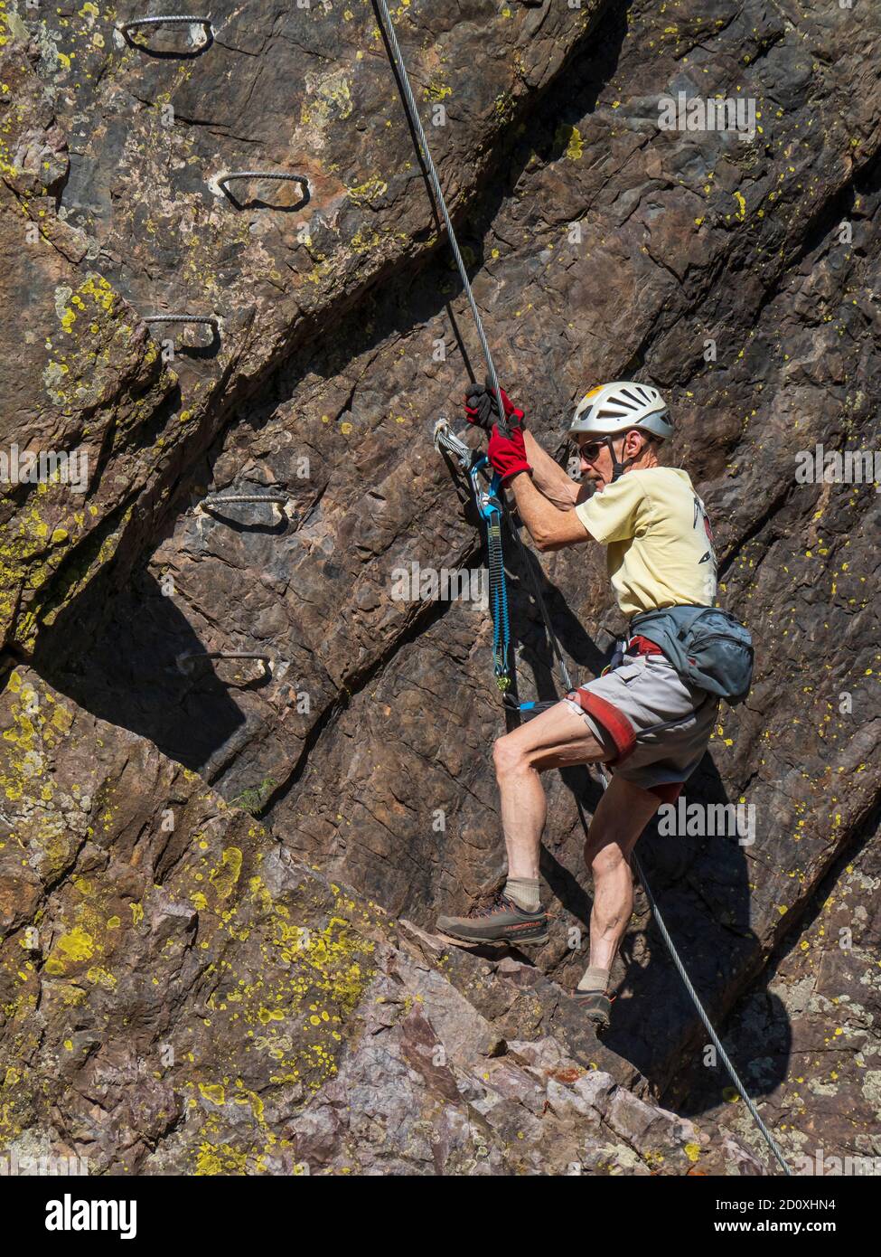 Man, aged 80+, climbs on the Ouray Via Ferrata, Ouray, Colorado Stock ...