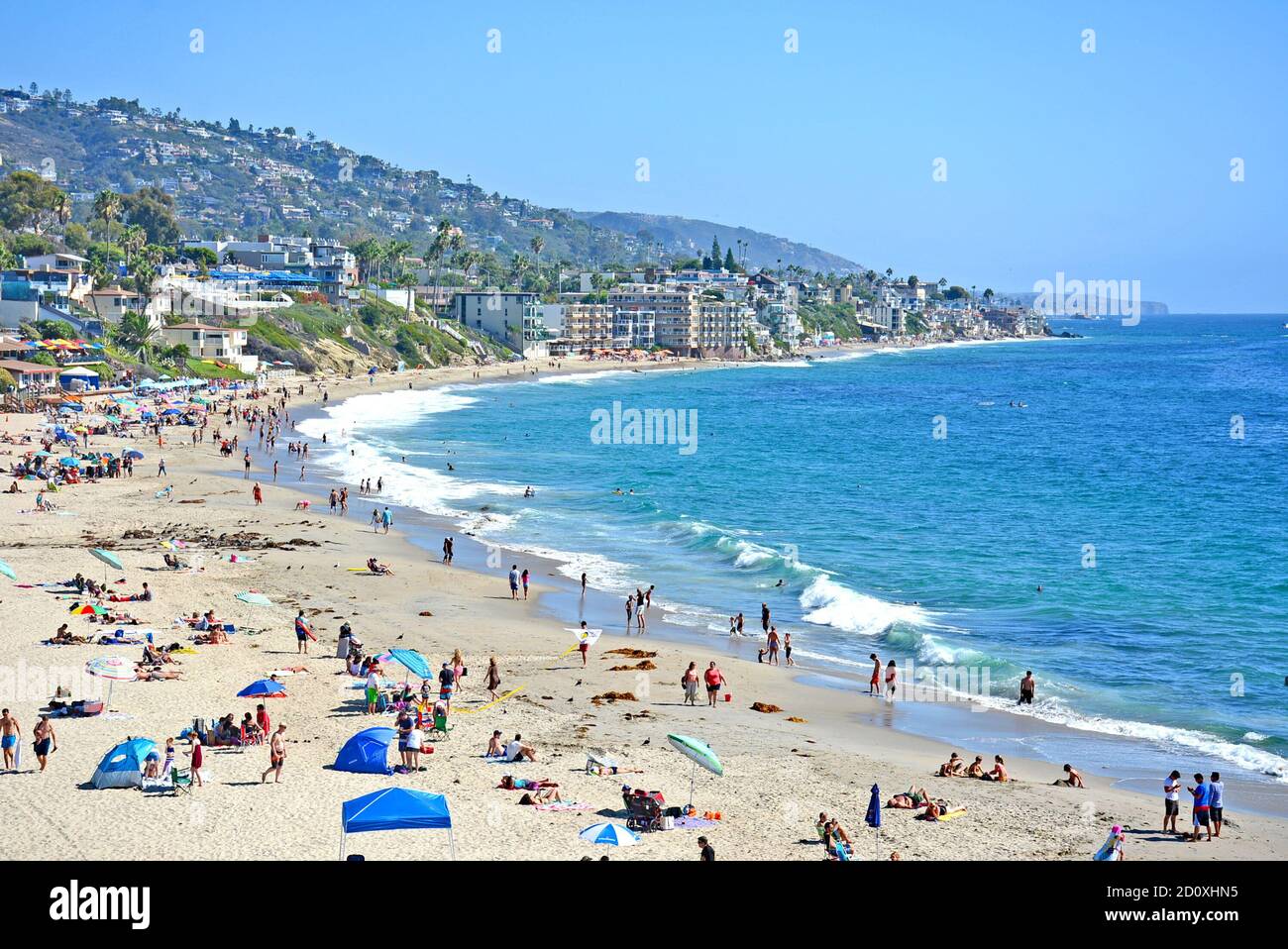 View of crowded sunny summer day at Southern California beach and ...