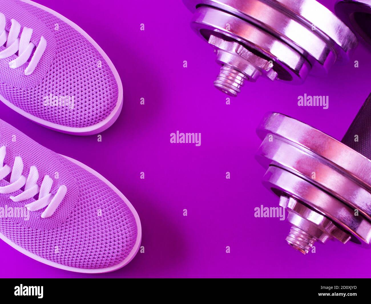 Bright violet sneakers on a purple background with dumbbells from ...