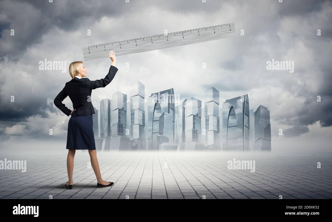 Woman with ruler Stock Photo - Alamy