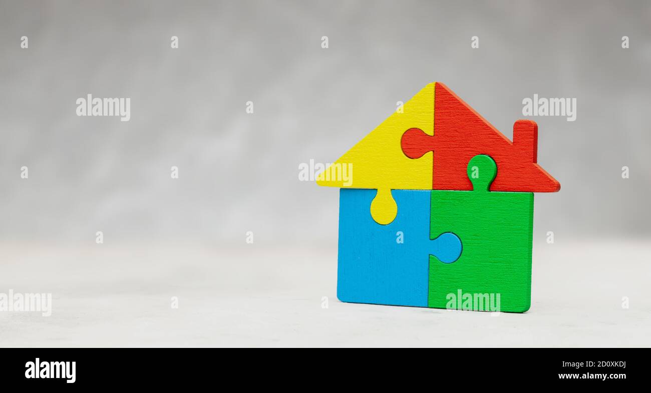 House puzzle Home loan. Parts of the house are brought together Stock ...