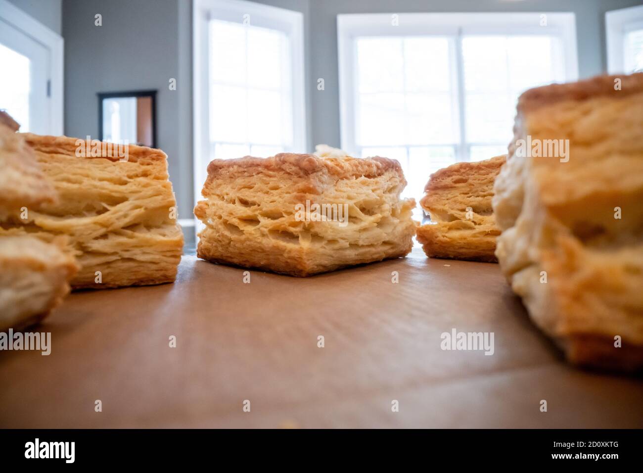 Low Angle of Square Biscuits on parchment paper Stock Photo - Alamy