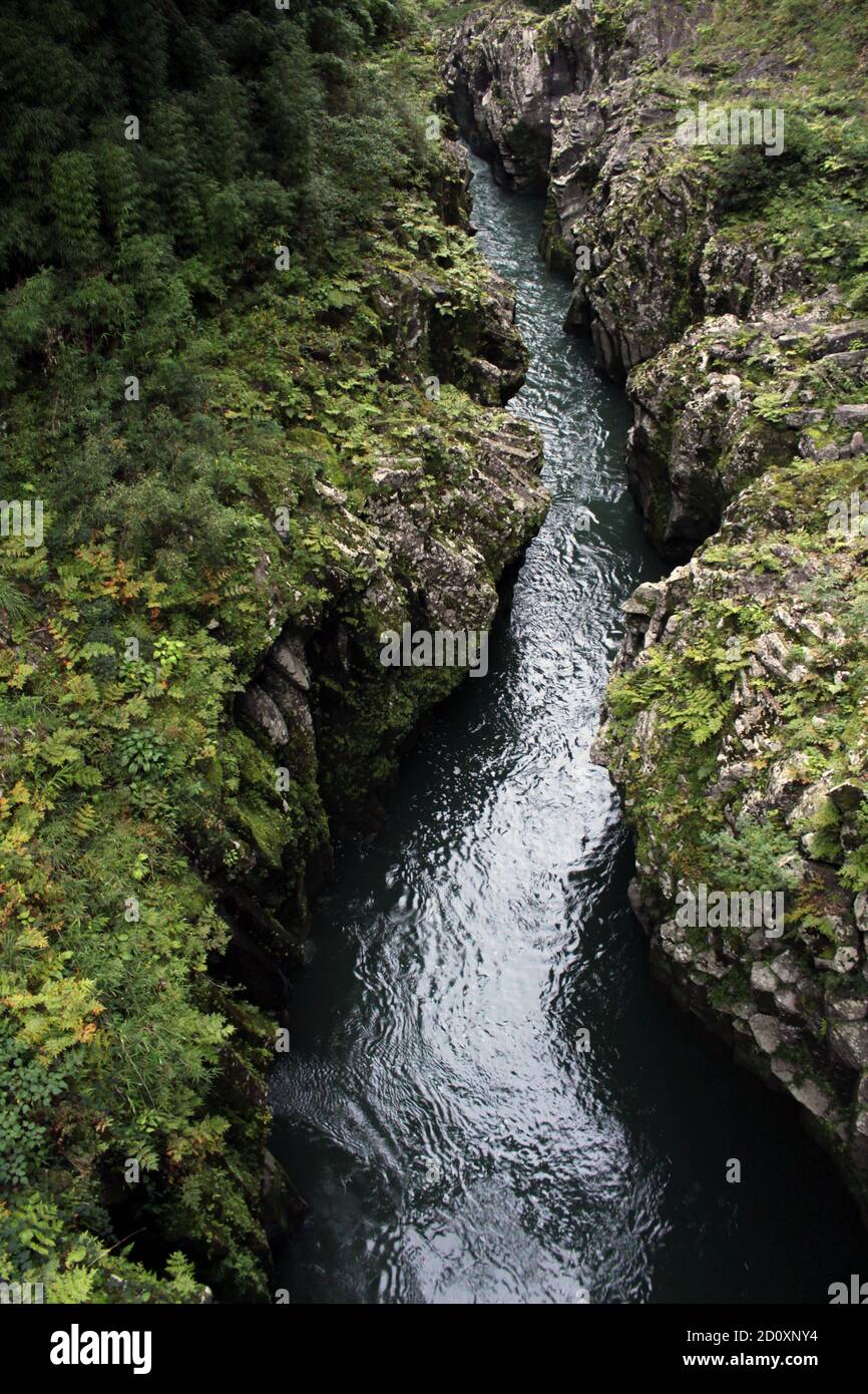 Overlooking rushing river from a bridge at Takachiho Gorge in Miyazaki ...