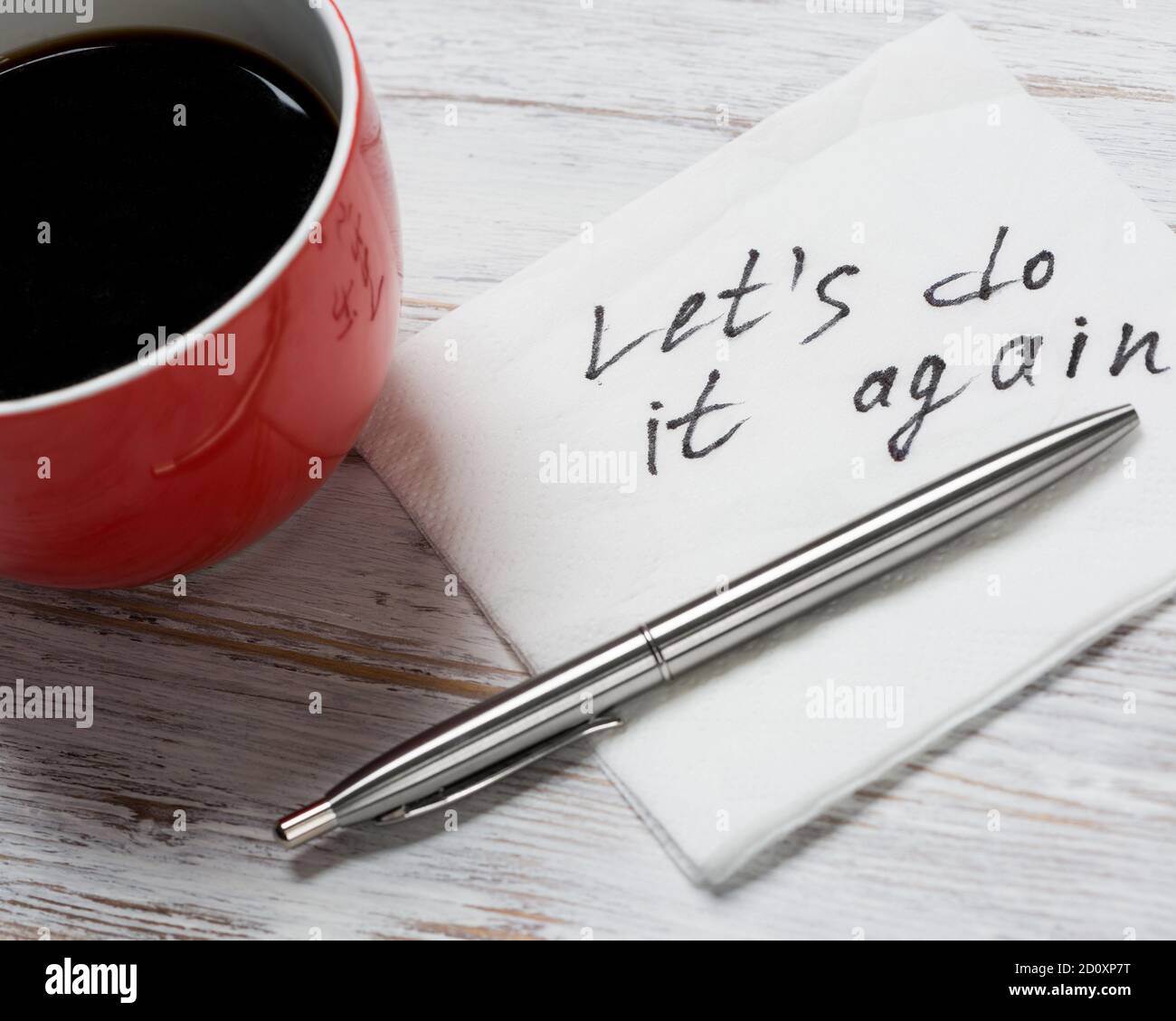 Let us do it again written on napkin Stock Photo - Alamy