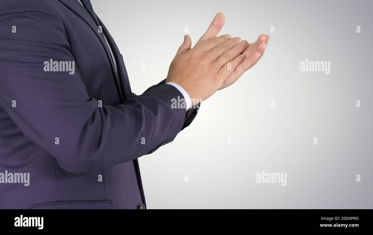 Business man clapping hands on gradient background Stock Photo - Alamy Business man clapping hands on gradient background Stock Photo - Alamy