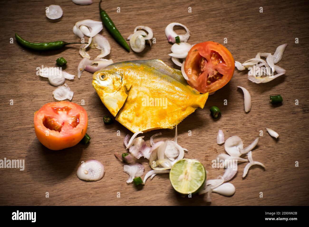 Close-up of pamphlet fish ready to cooking laying on wooden background ...