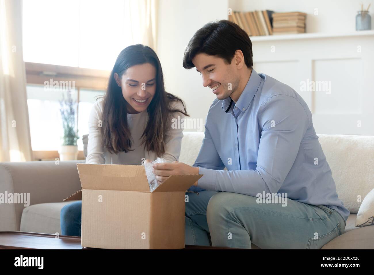 Female customer receiving parcel hi-res stock photography and images ...