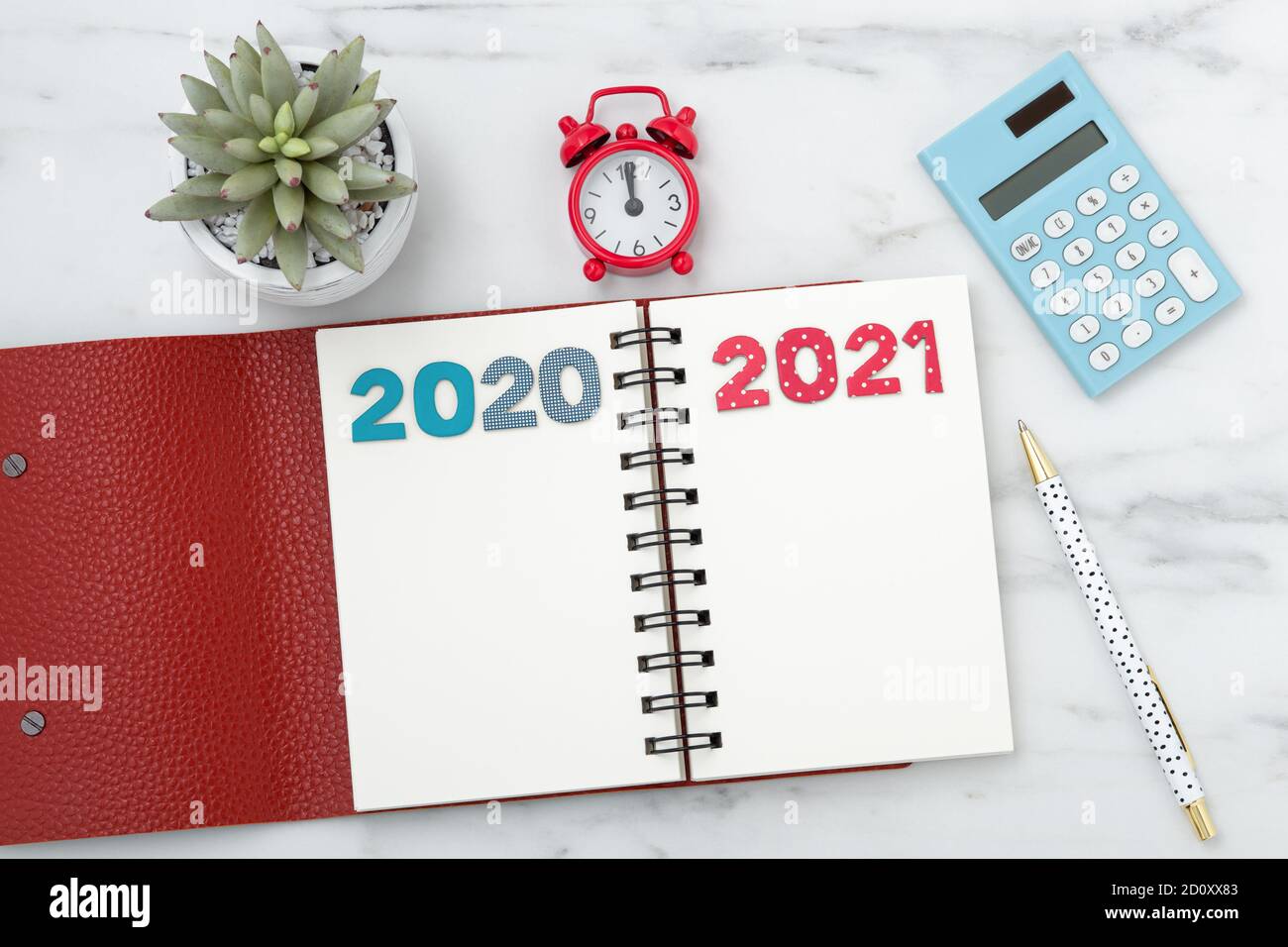 Planner with year 2020 and 2021 on desk with clock and calculator Stock ...