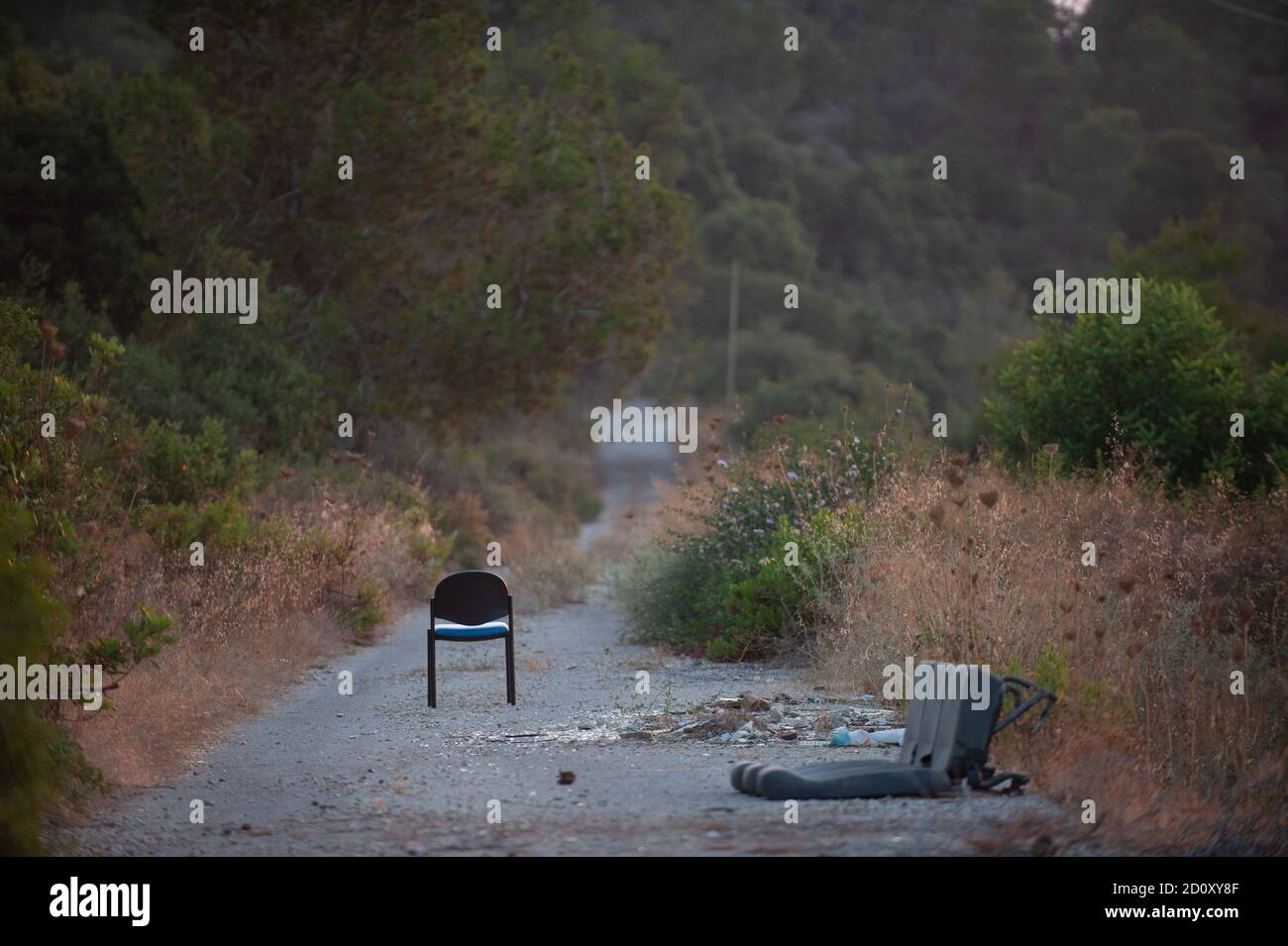 Landscape view with a useless office chair left in the middle of the ...