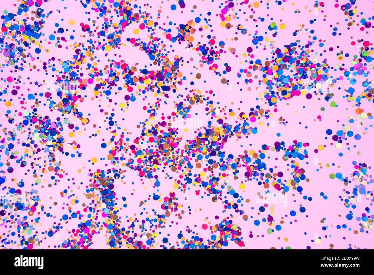 Colorful sparkles on trendy pink pastel background for your creative ...