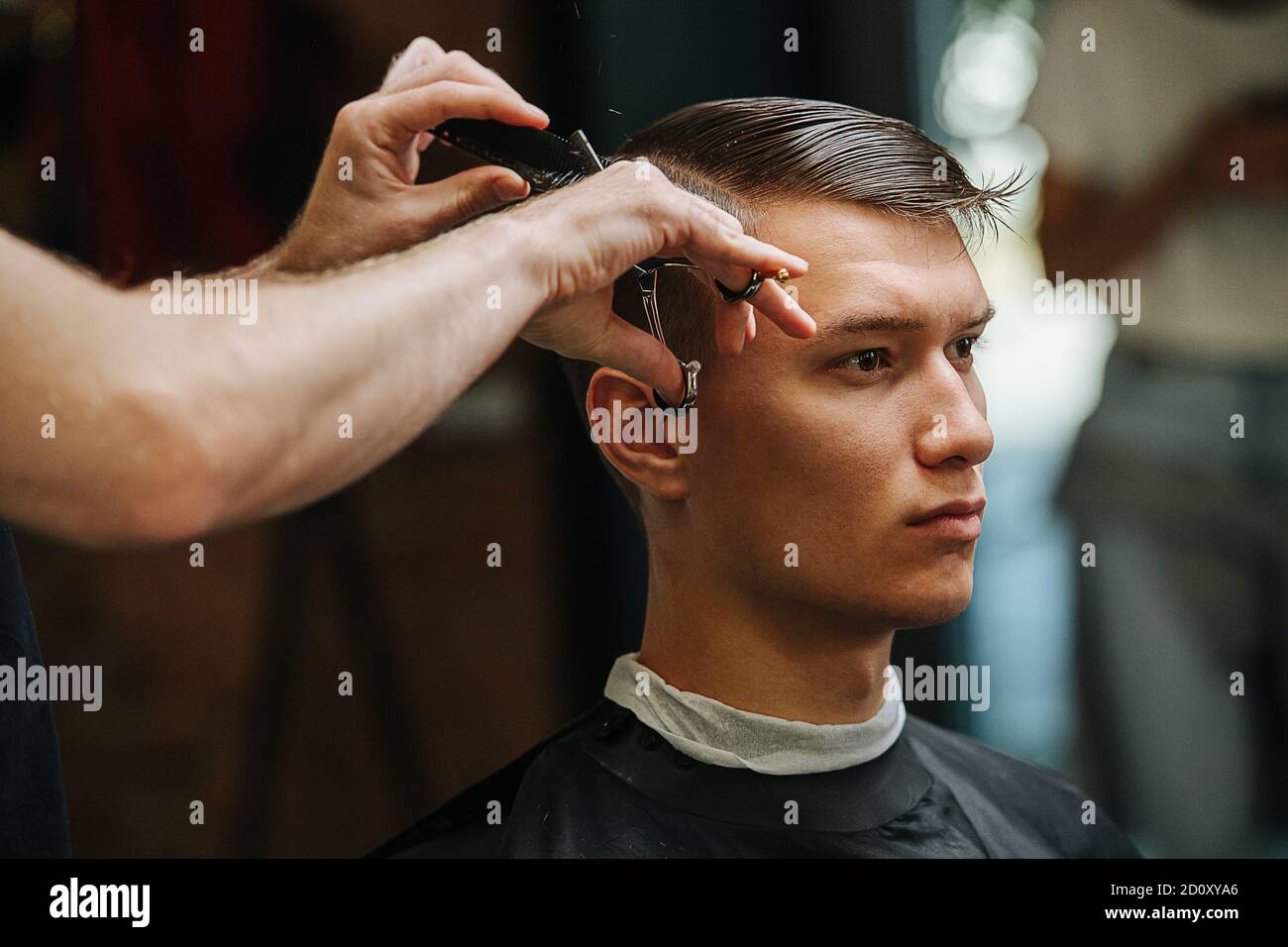 Self-respecting serious young man in a barber shop Stock Photo - Alamy