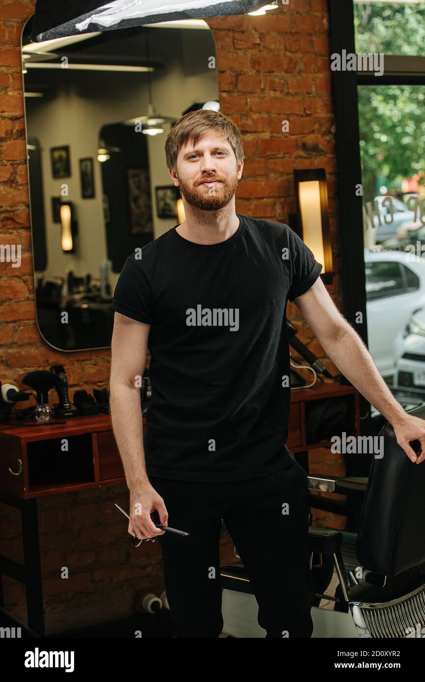Proud charming male hairdresser in a barber shop Stock Photo - Alamy