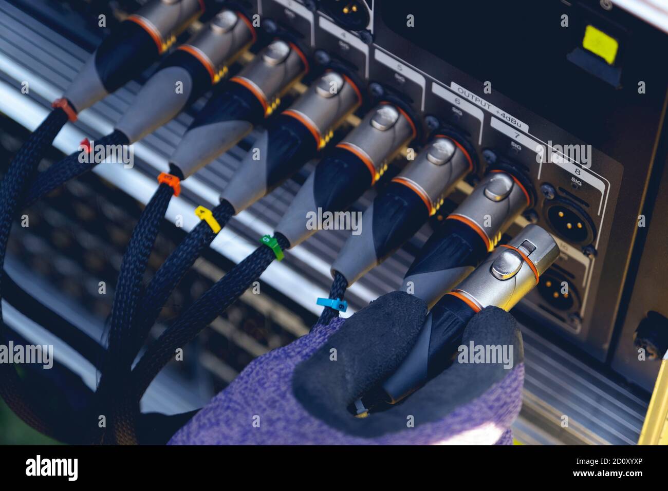 Sound engineer plugging audio cable on studio system boxes Stock Photo ...