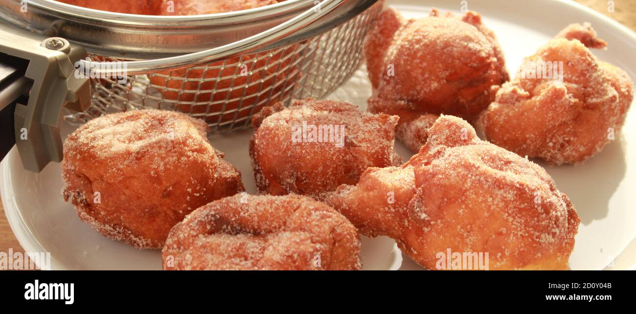 fresh donuts deep-fried in the deep fryer Stock Photo - Alamy