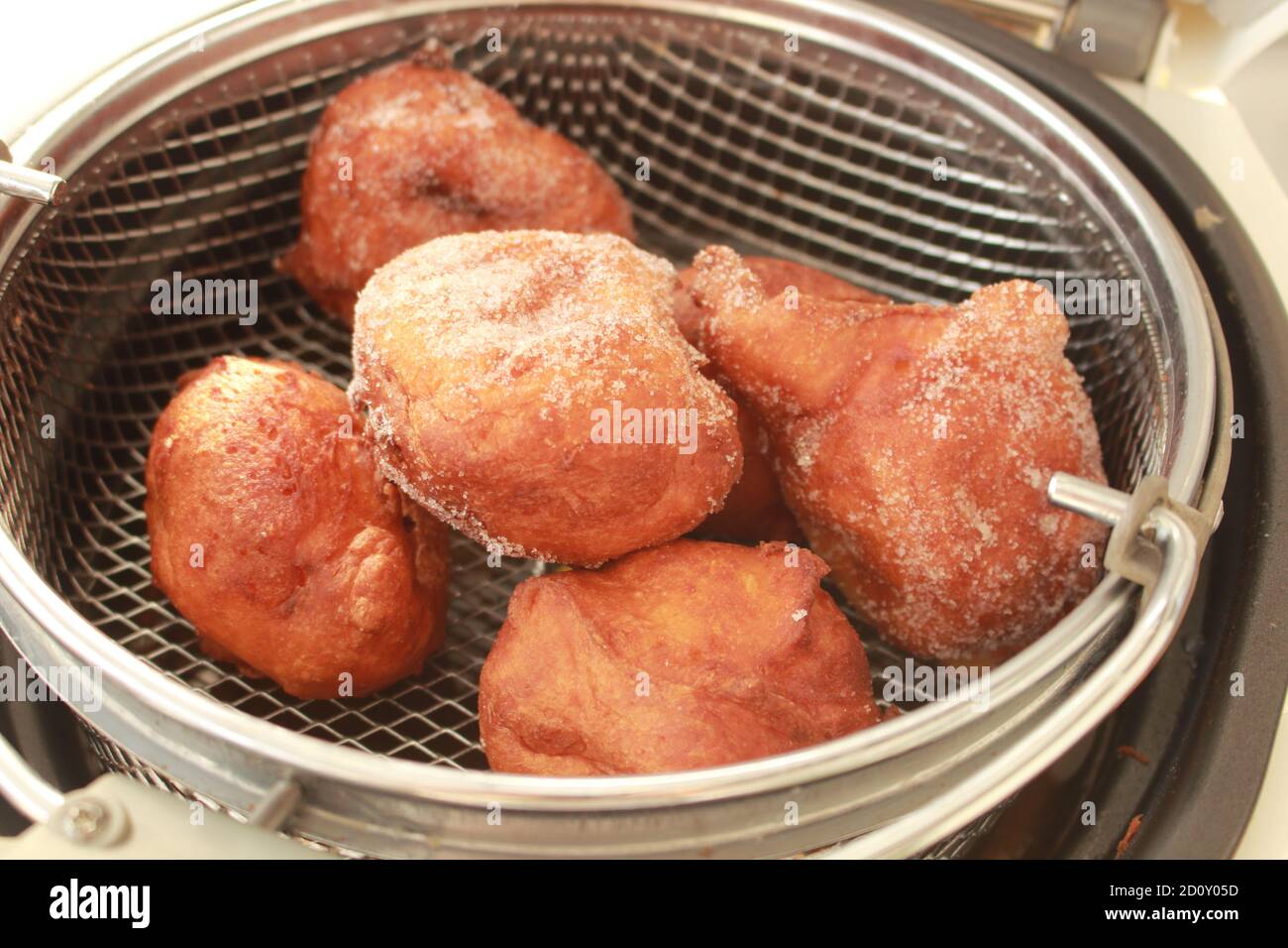fresh donuts deep-fried in the deep fryer Stock Photo - Alamy