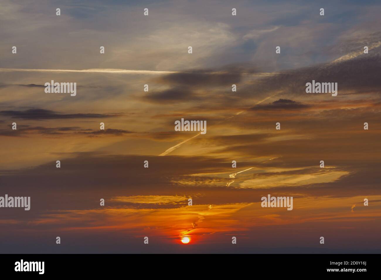Sun setting over the Welsh hills Stock Photo - Alamy