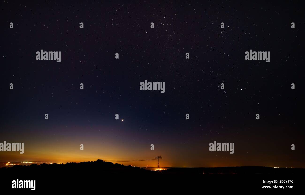 Night landscape with light from the city on the horizon Stock Photo - Alamy