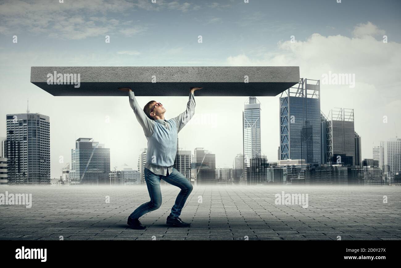 Guy lifting cement banner Stock Photo - Alamy