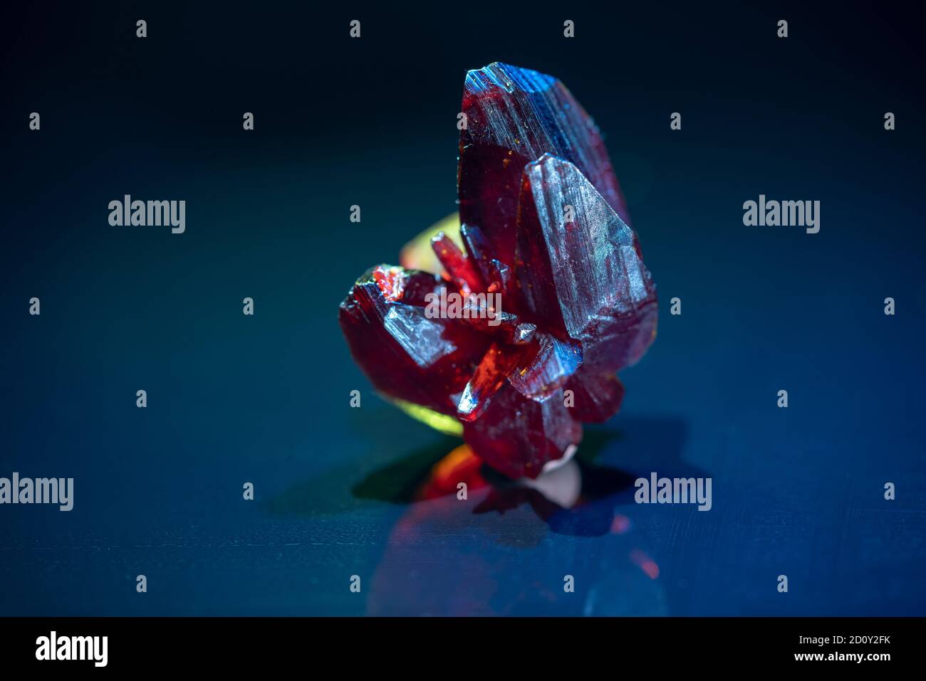 Precious red mineral on black background Stock Photo - Alamy