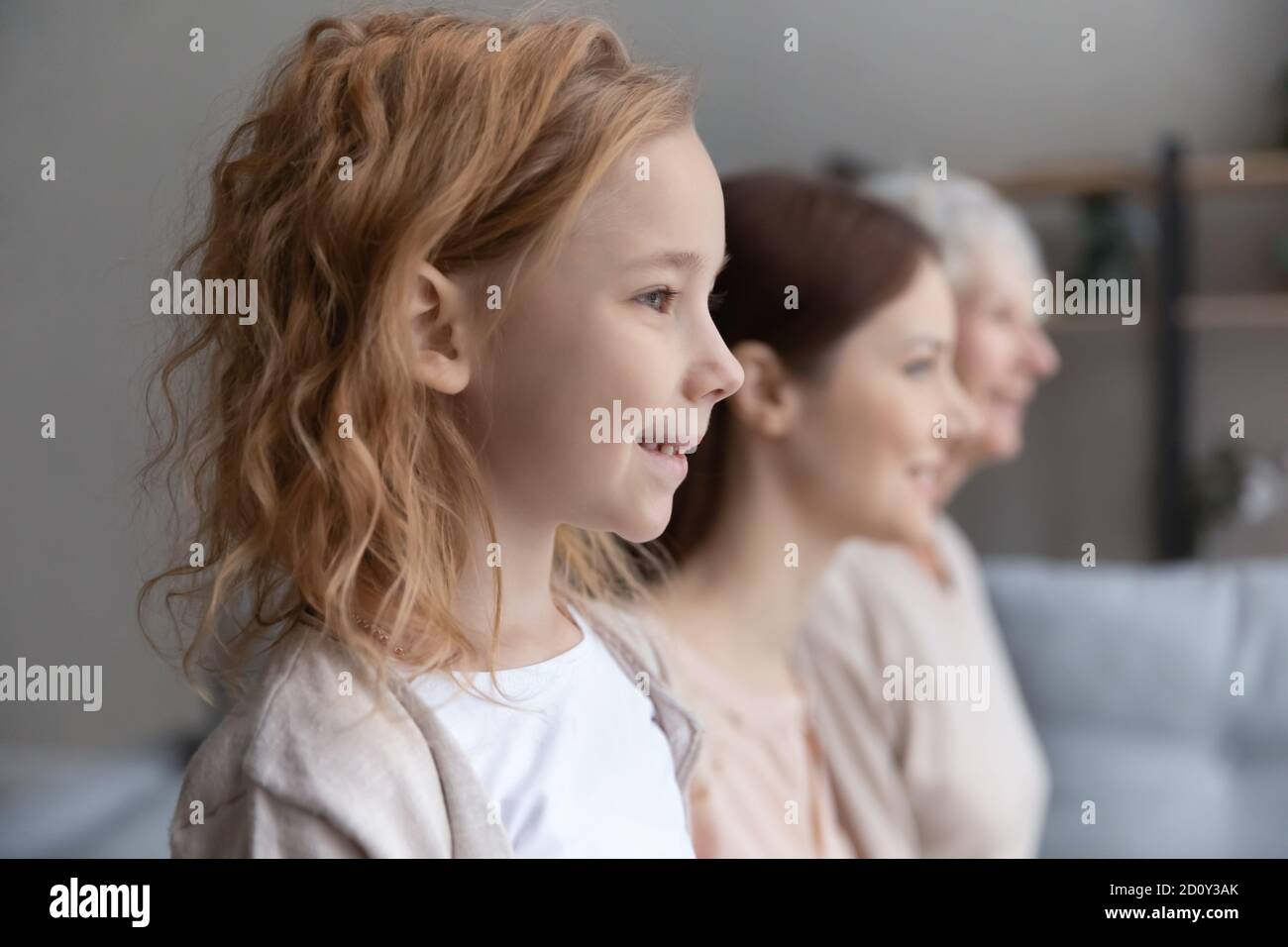 Close up three generations of women standing in row Stock Photo - Alamy