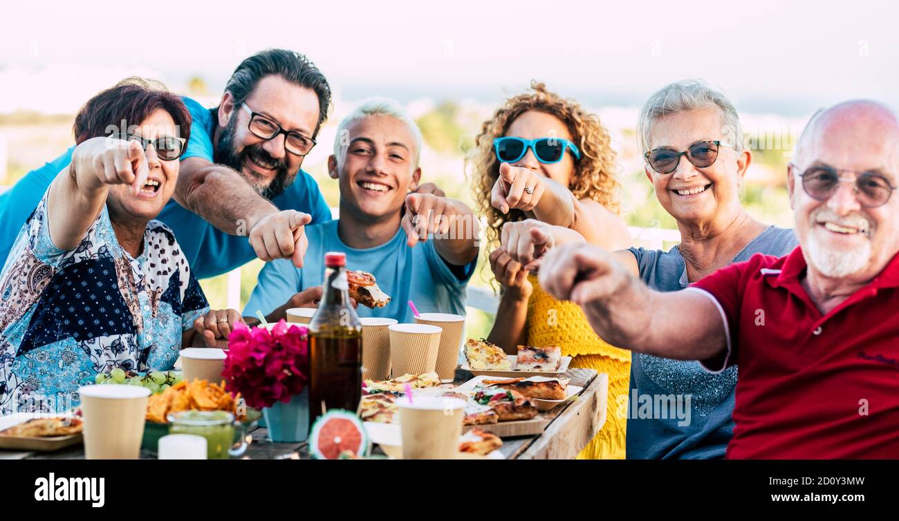 focus on hands - group of mixed ages family friends people enjoy and ...