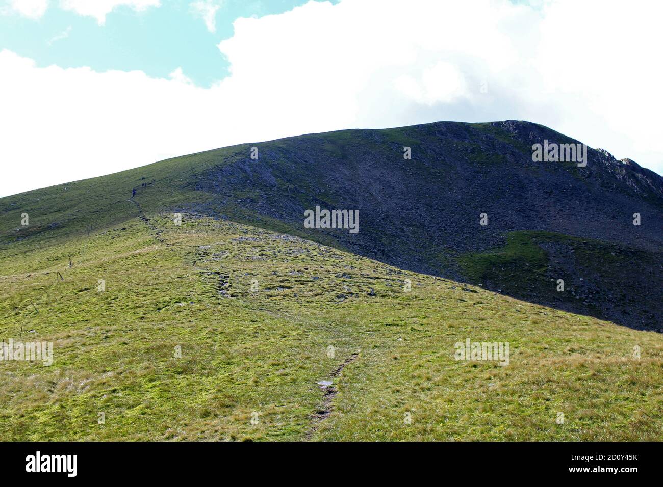 Group of people walking up path to summit of Moelsyn Mawr Snowdonia ...