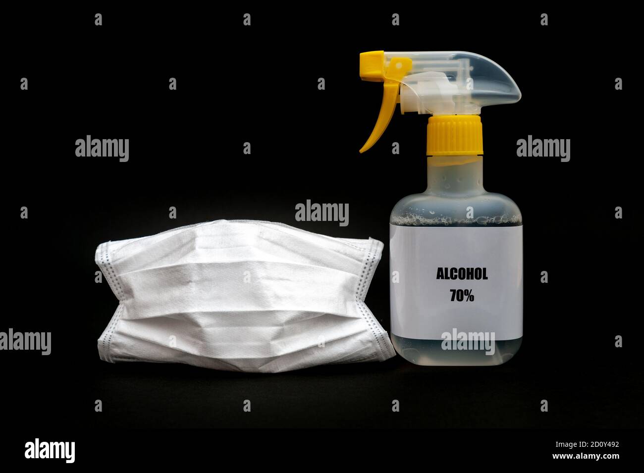 Alcohol 70% spray and white surgical mask for protection against ...