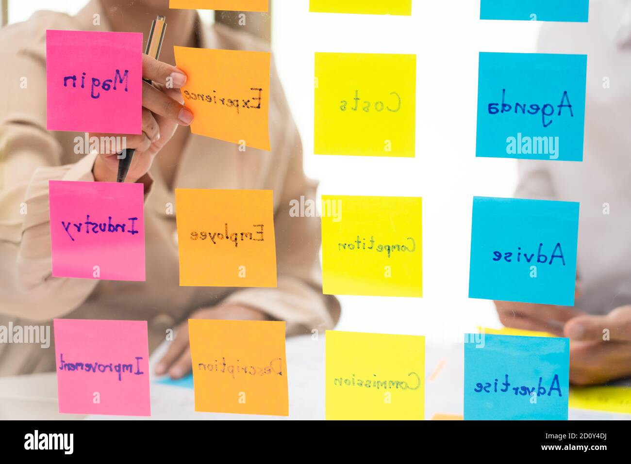 business people planning startup project placing sticky notes session ...