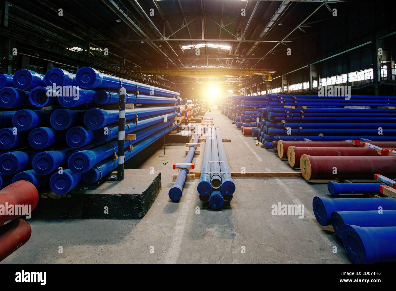 New cast iron pipes for pipeline construction in warehouse Stock Photo ...