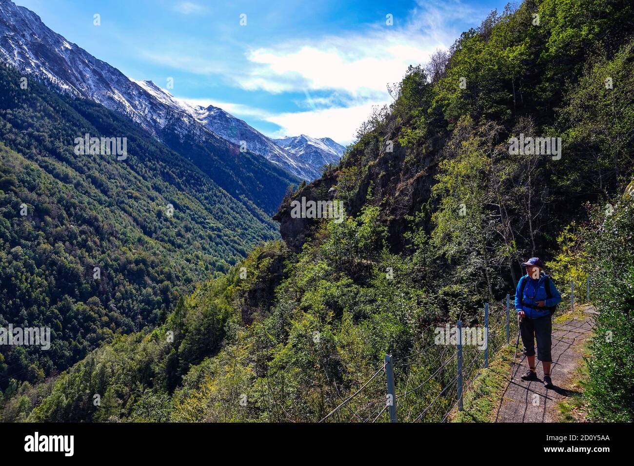 Solitary female walker, hiker, on the old aqueduct that provided power ...