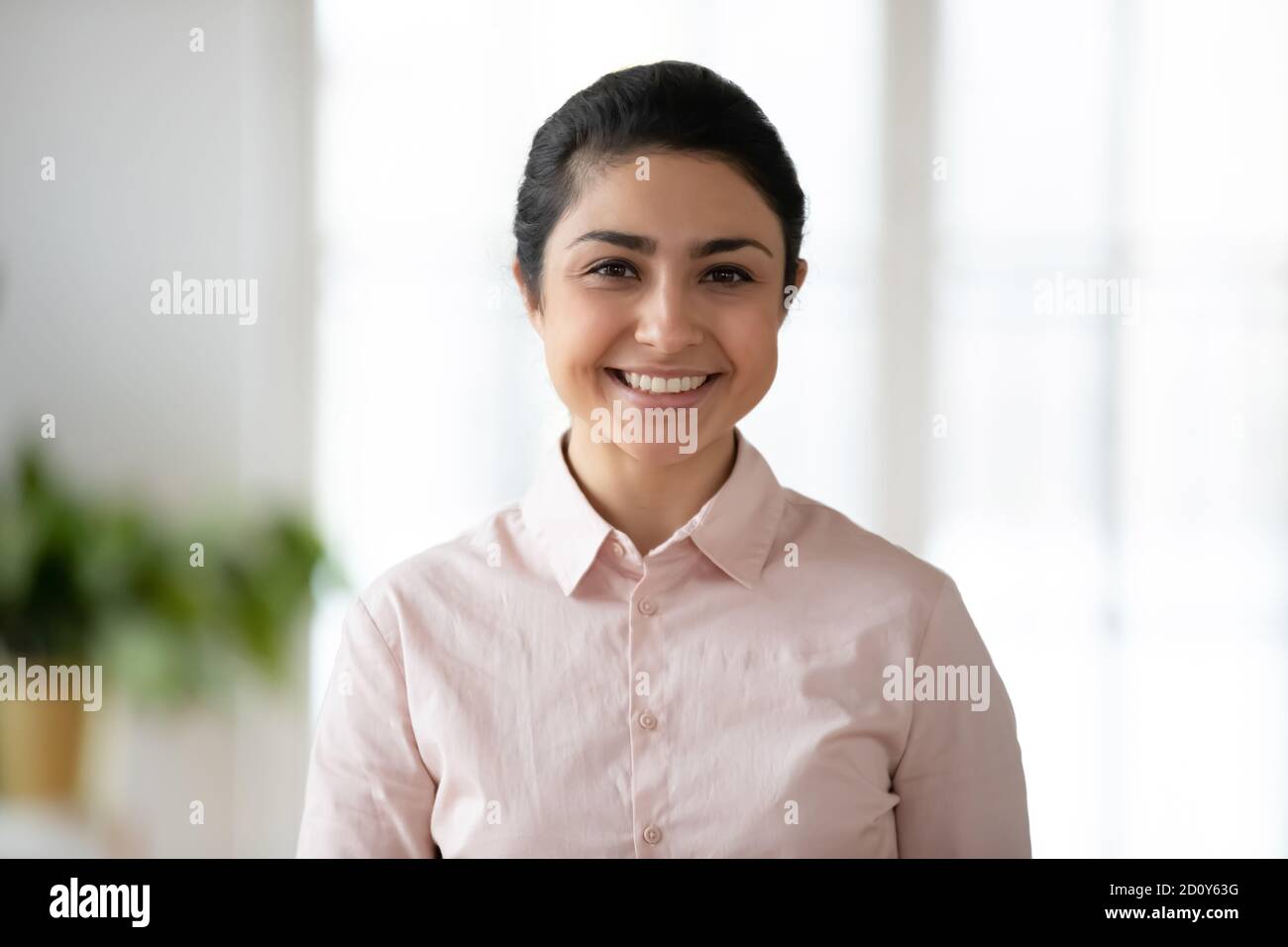 Profile picture of smiling Indian female employee Stock Photo - Alamy