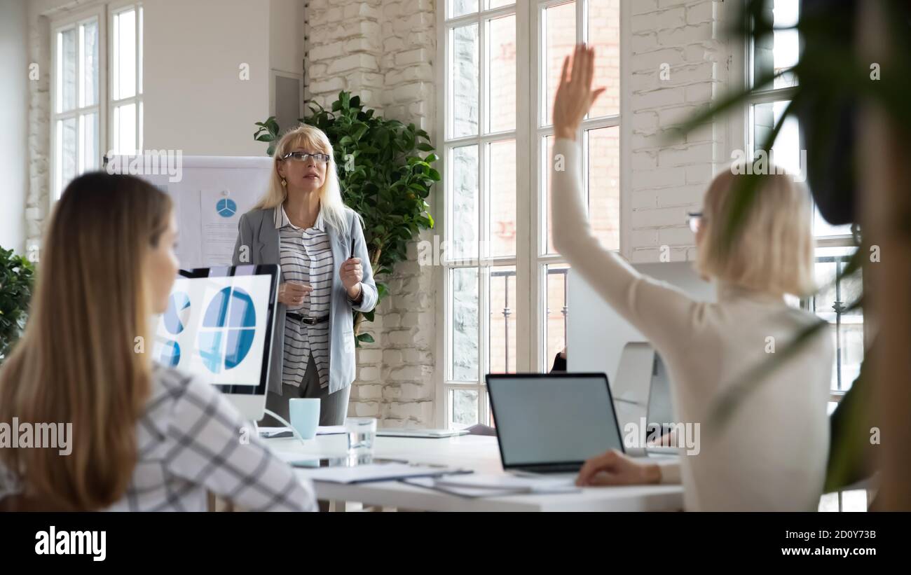 Female raise hand want to speak hi-res stock photography and images - Alamy