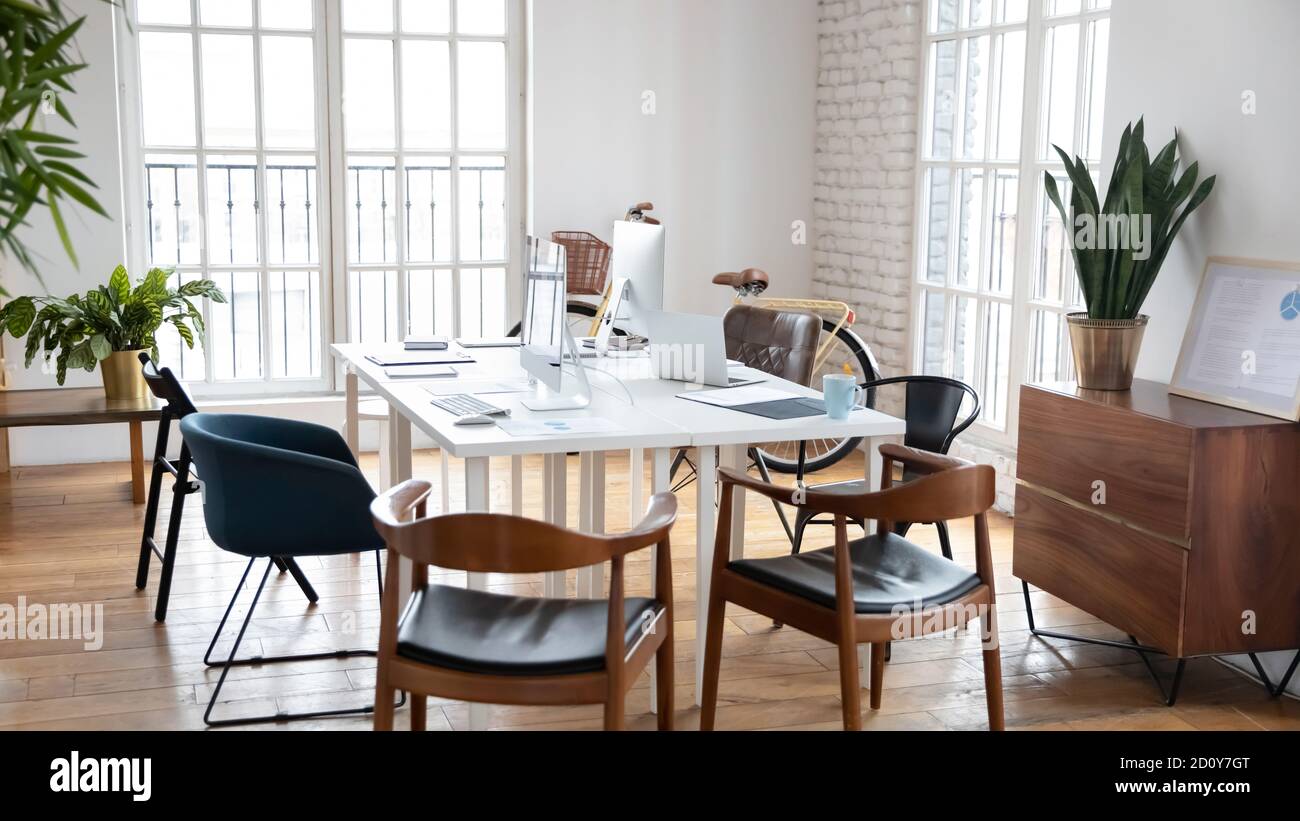 Empty modern office with modern gadgets on desk Stock Photo - Alamy