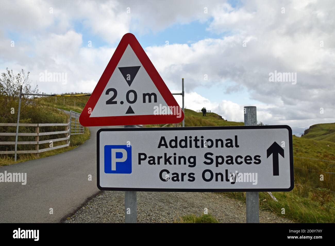 Two metre height restriction with blurred barrier in background. Sign ...