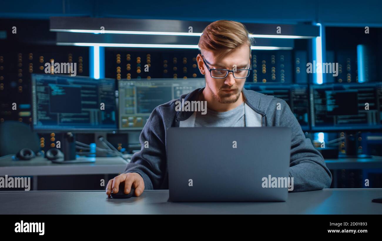 Portrait of Software Developer Hacker Wearing Glasses Sitting at His ...