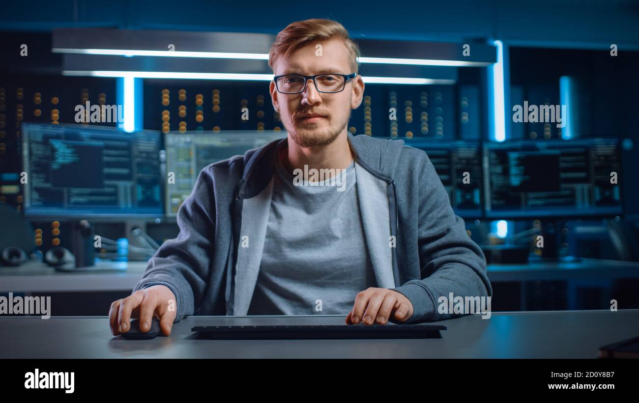 Portrait of Software Developer Hacker Wearing Glasses Sitting at His ...