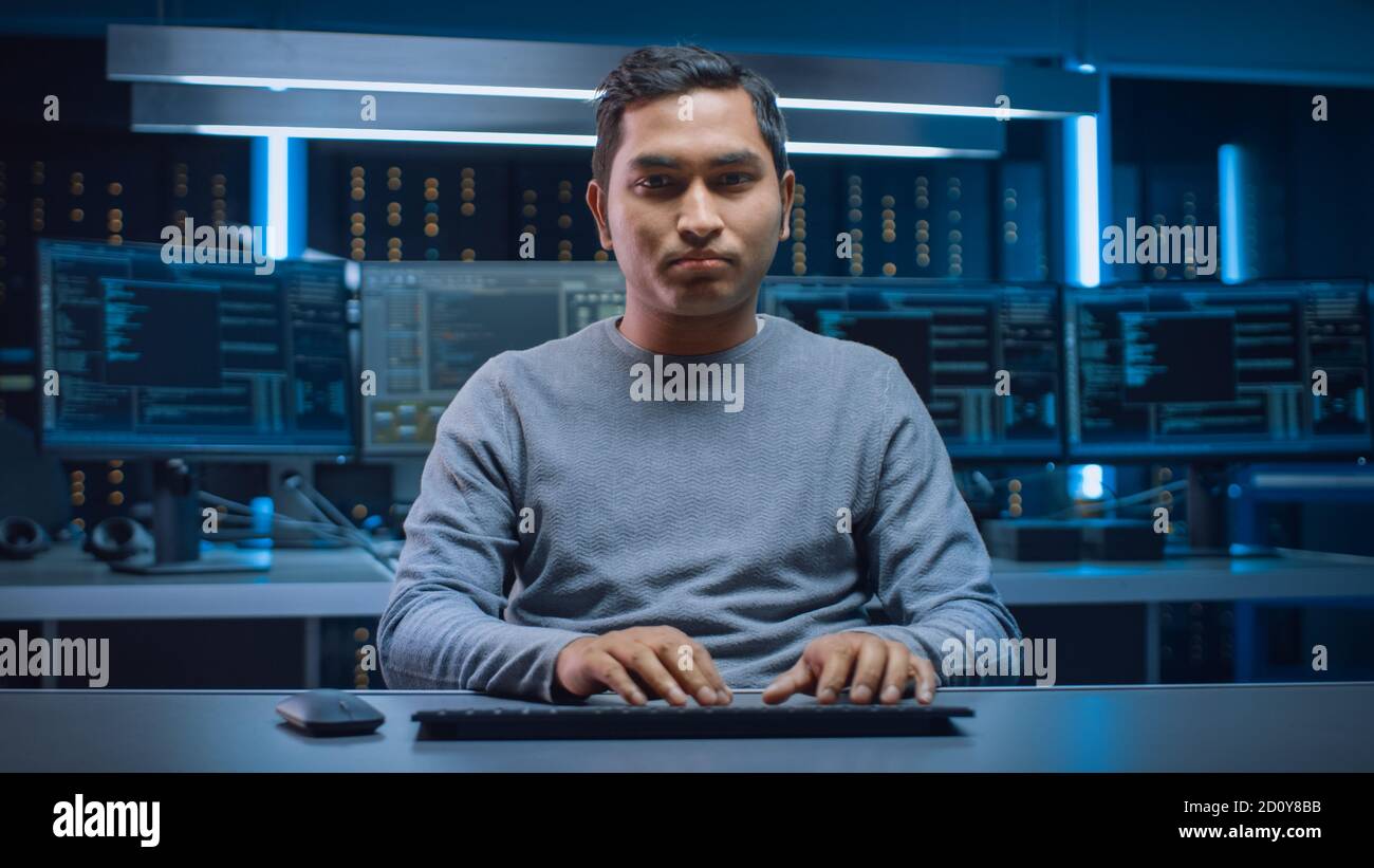 Portrait of Software Programmer Sitting at His Desk and Working on ...