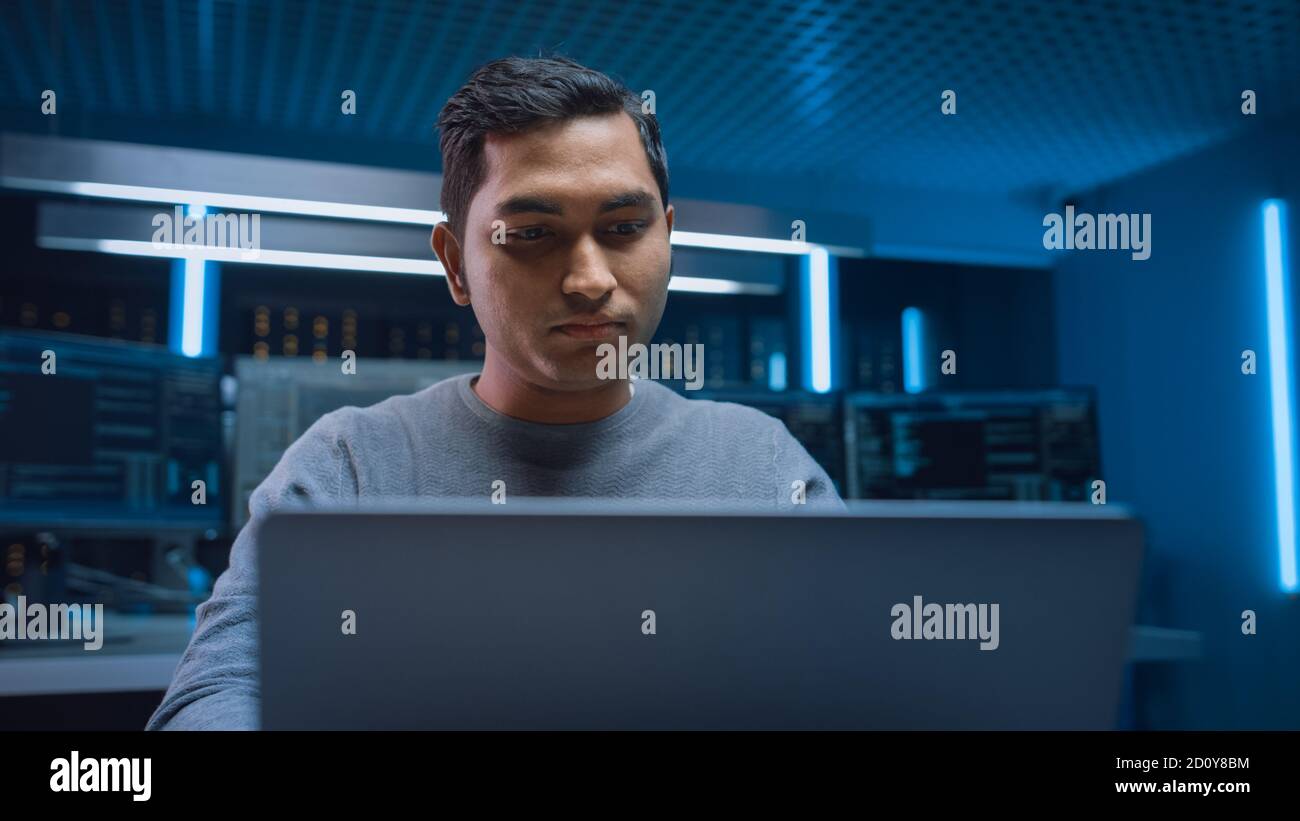 Portrait of Software Programmer Sitting at His Desk and Working on ...